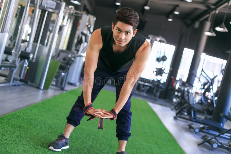 Portrait of a Man Doing Stretching Exercises at Gym. Stock Image ...