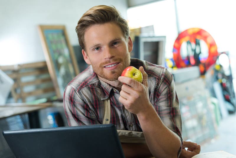 Portrait man eating apple stock photo. Image of handsome - 260343292