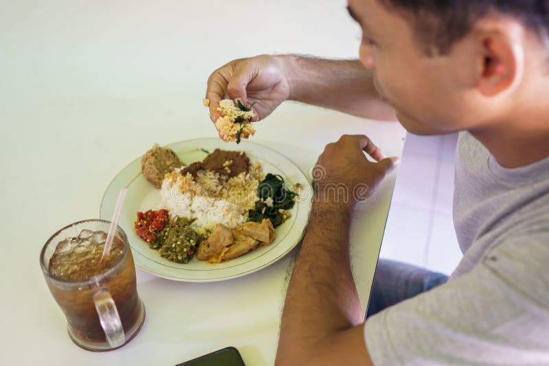 Portrait of a man eating stock image. Image of asian - 199153349