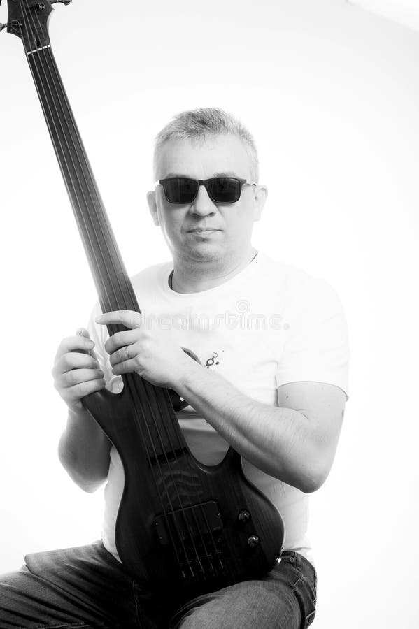 Portrait of a Man with an Electric Guitar in His Hands, Made in a High ...