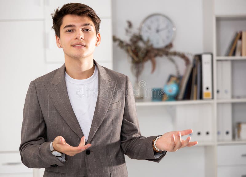 Portrait of Man Employee Posing in Modern Office Interior, Offering ...