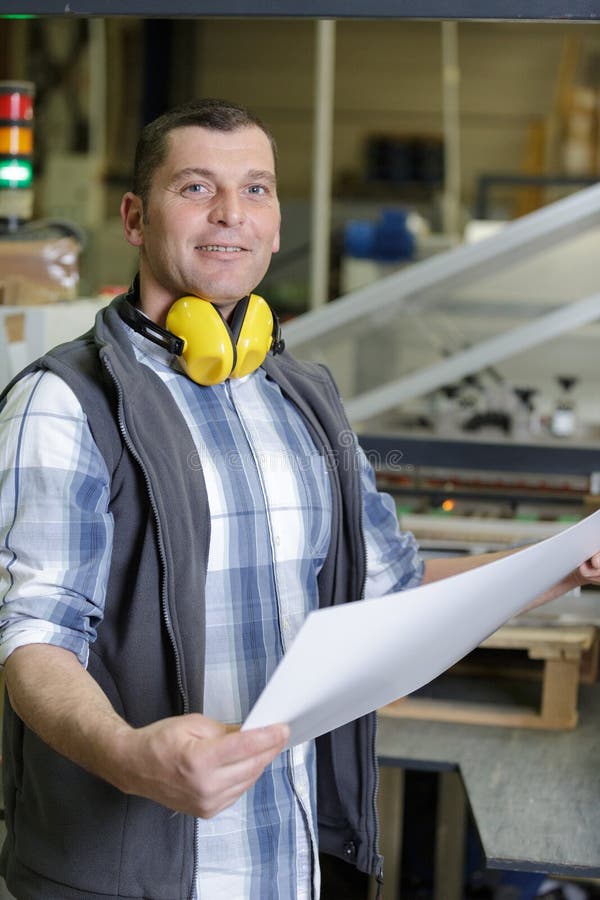 Portrait man in factory stock photo. Image of adult - 261514334