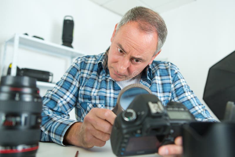 Portrait man fixing camera stock photo. Image of workshop - 264200292