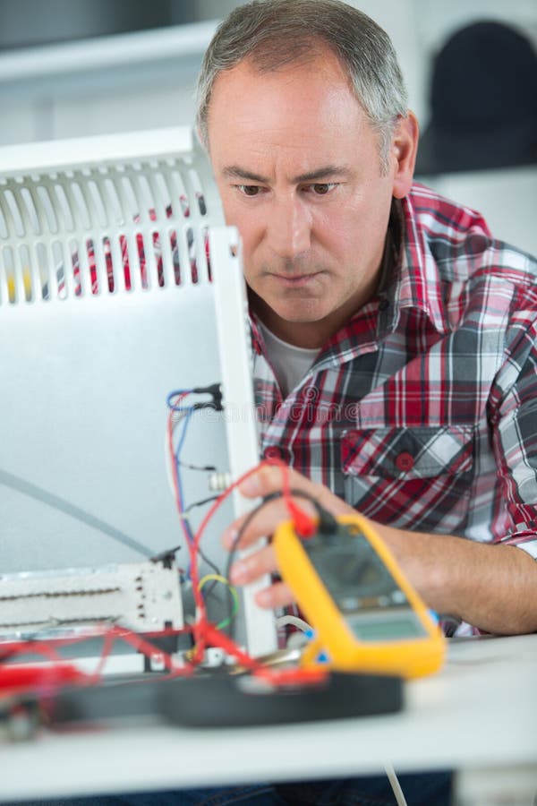 Portrait Man Fixing Radiator Stock Image - Image of indoors, service ...
