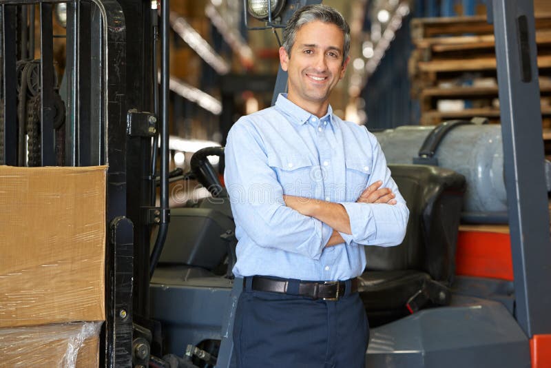 Portrait of Man with Fork Lift Truck in Warehouse Stock Image - Image ...