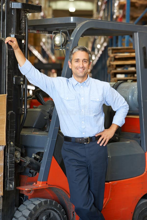 Portrait of Man with Fork Lift Truck in Warehouse Stock Image - Image ...