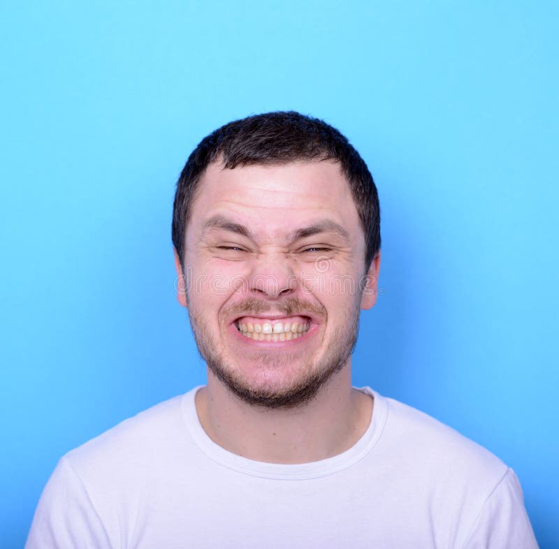 Portrait of Man with Dusgusted Gesture Against Blue Background Stock ...