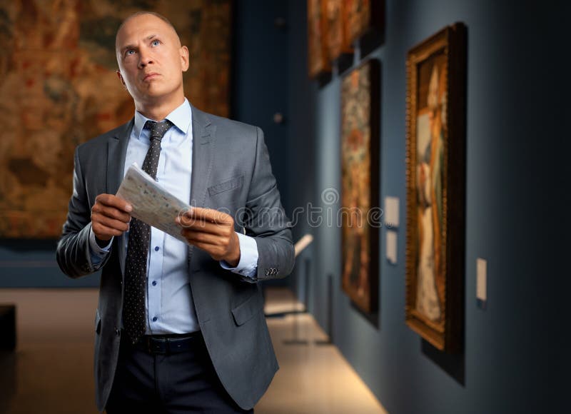 Portrait of Man with a Guide Looking at Pictures at Museum Stock Photo ...