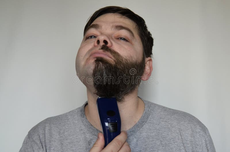 Portrait of a Man with a Half Beard. a Bearded Man Shaves, Shaves His ...
