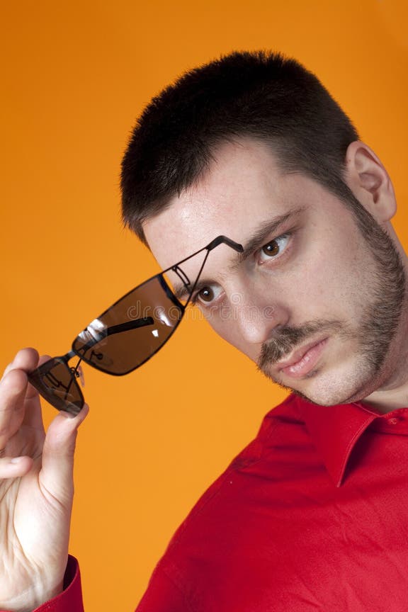 Portrait of a Man Holding Sunglasses Stock Image - Image of model, give ...