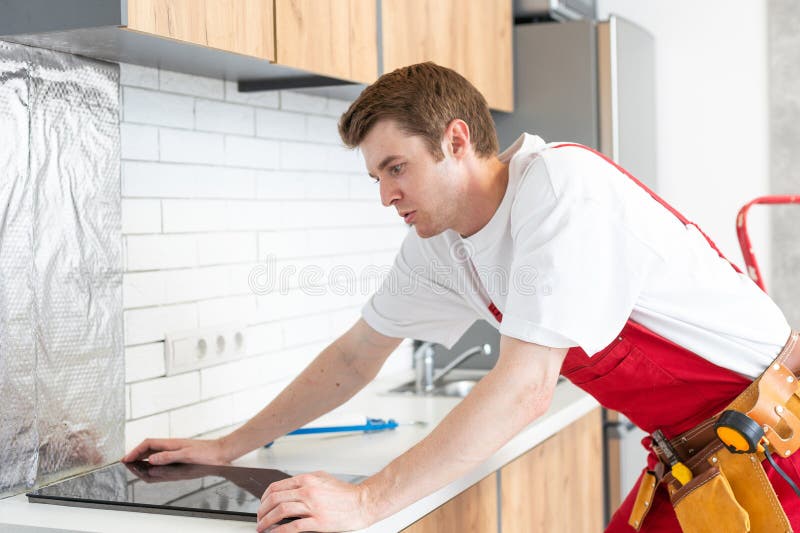 Portrait of Man Installing Kitchen Hob Stock Image - Image of install ...