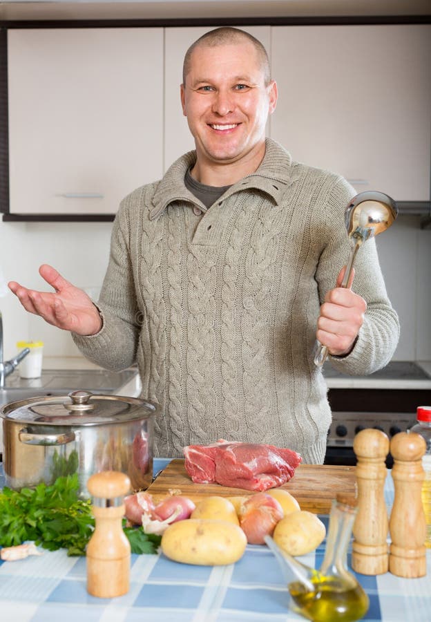 Portrait of man at kitchen stock photo. Image of happy - 55161626