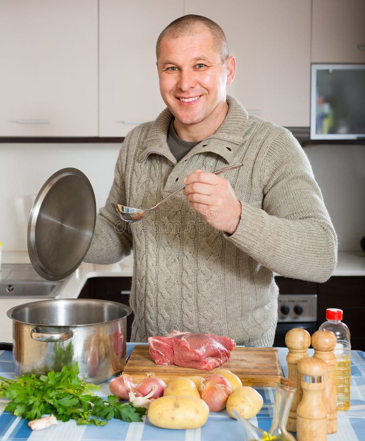 Portrait of man at kitchen stock photo. Image of house - 56603964
