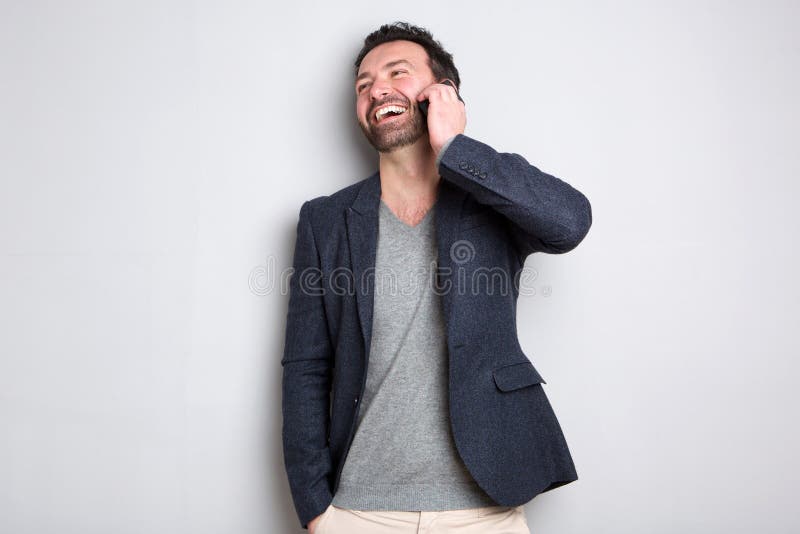 Man Laughing and Talking on Cellphone Stock Image - Image of older ...