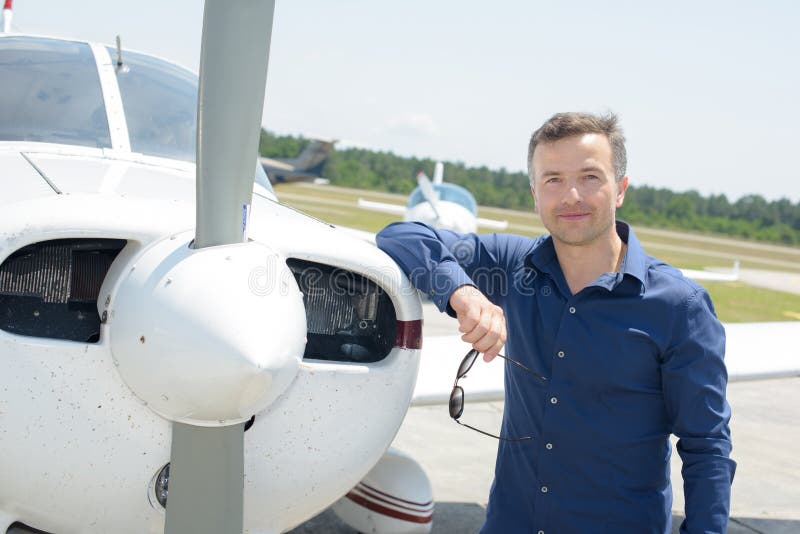 Portrait Man Leaning on Aircraft Stock Photo - Image of alone, lessons ...