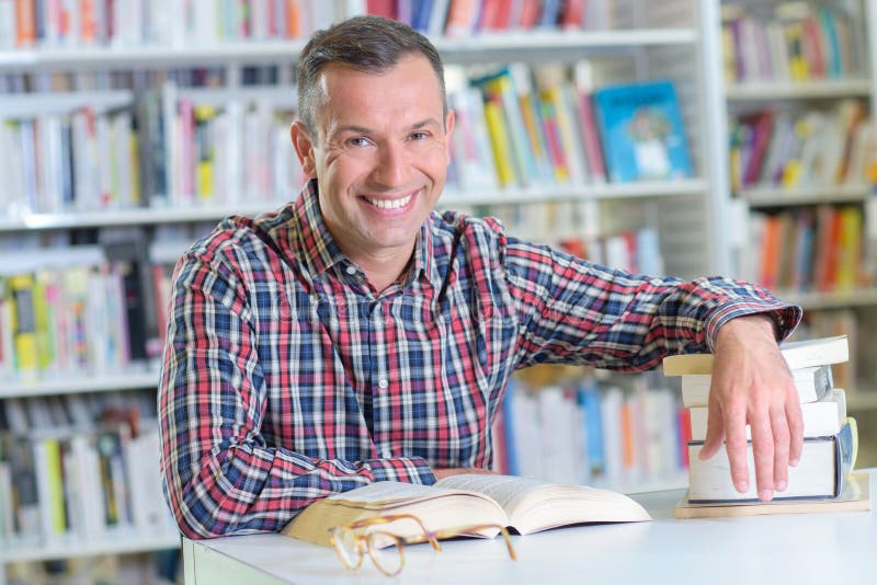 Portrait man in library stock photo. Image of middle - 84629578