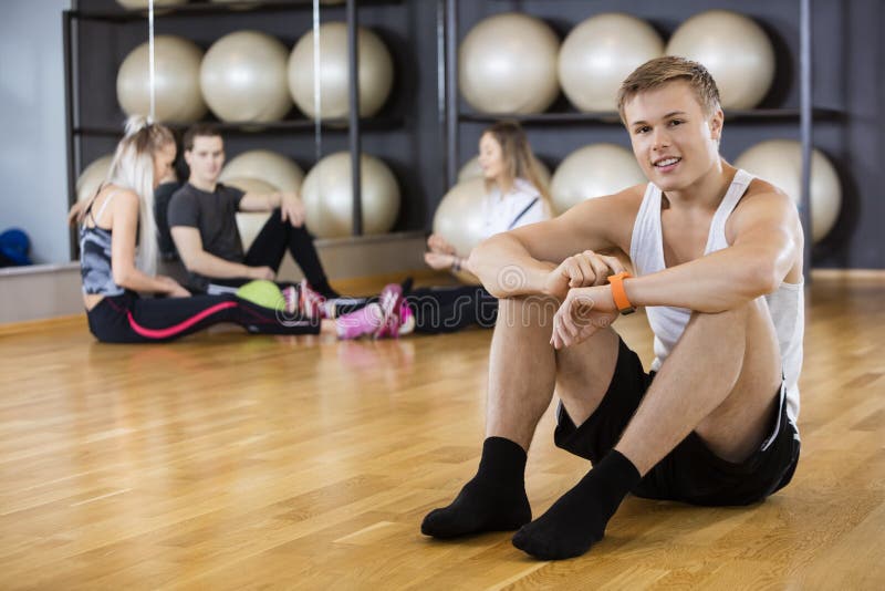 Portrait of Man Looking at Activity Tracker at Gym Stock Photo - Image ...