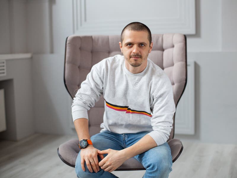 Portrait of Man Looking in Camera while Sitting on Chair Stock Image ...