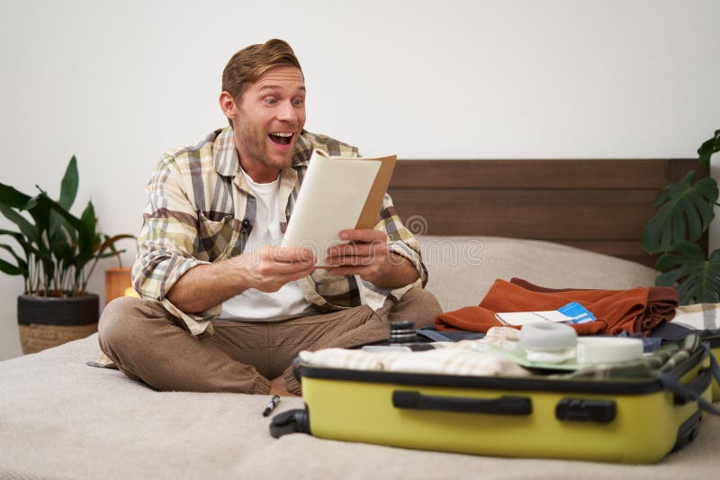 Portrait of Man Looking with Excitement at His Notebook, Reading Notes ...