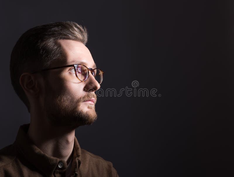 Portrait of a Man Looking at the Light from the Darkness Stock Photo ...