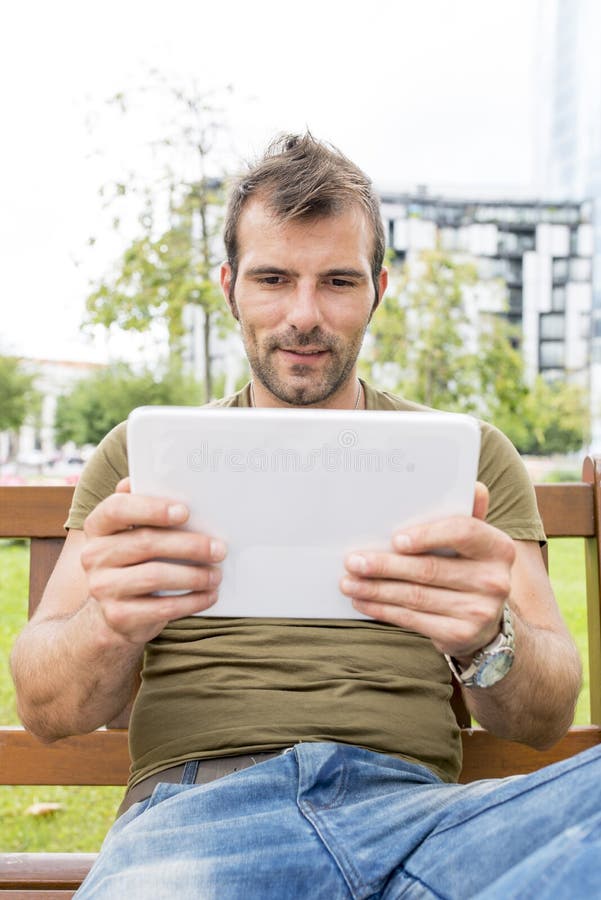 Portrait of Man Looking Message in the Tablet Computer, Outdoor. Stock ...