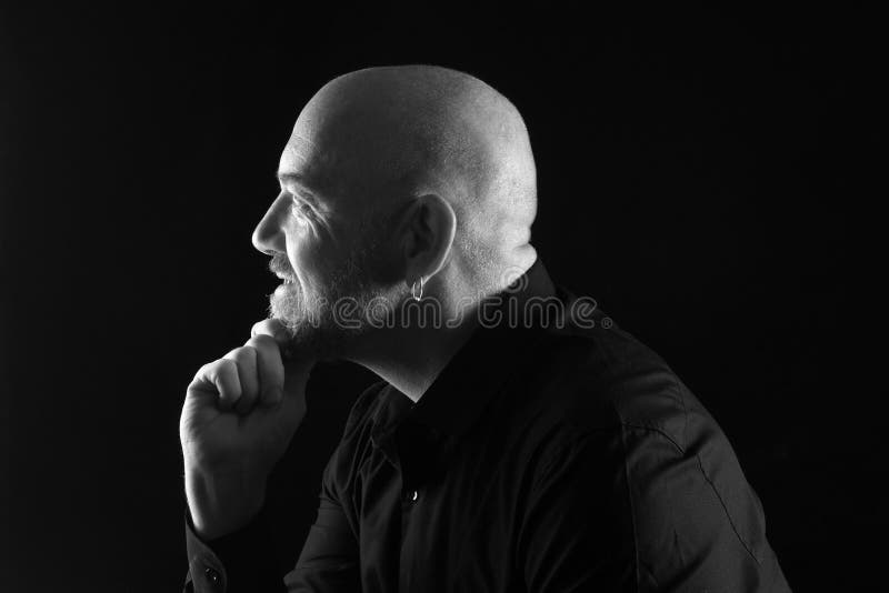 Portrait of a Man in Low Key, Smiling and Looking Side Black and Withe ...