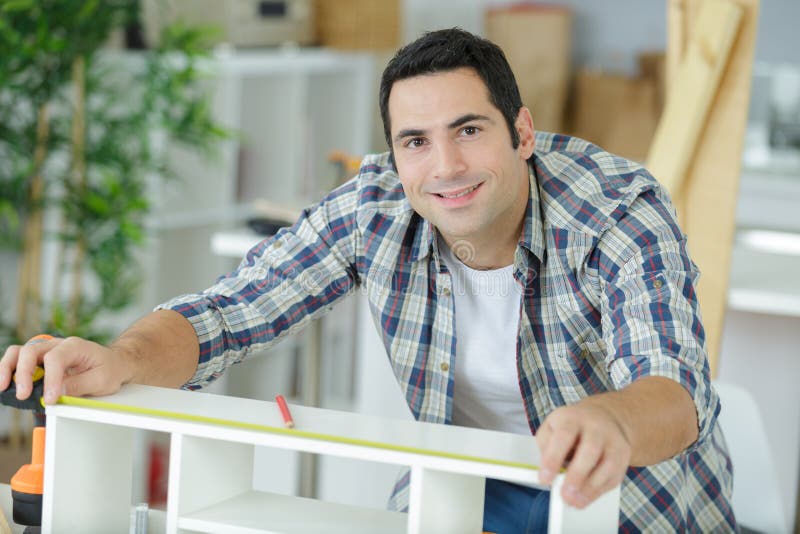 Portrait Man Measuring Furniture Stock Image - Image of power ...