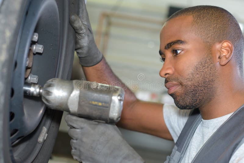 Portrait Man Mechanic Changing Tyre Stock Photo - Image of mechanic ...