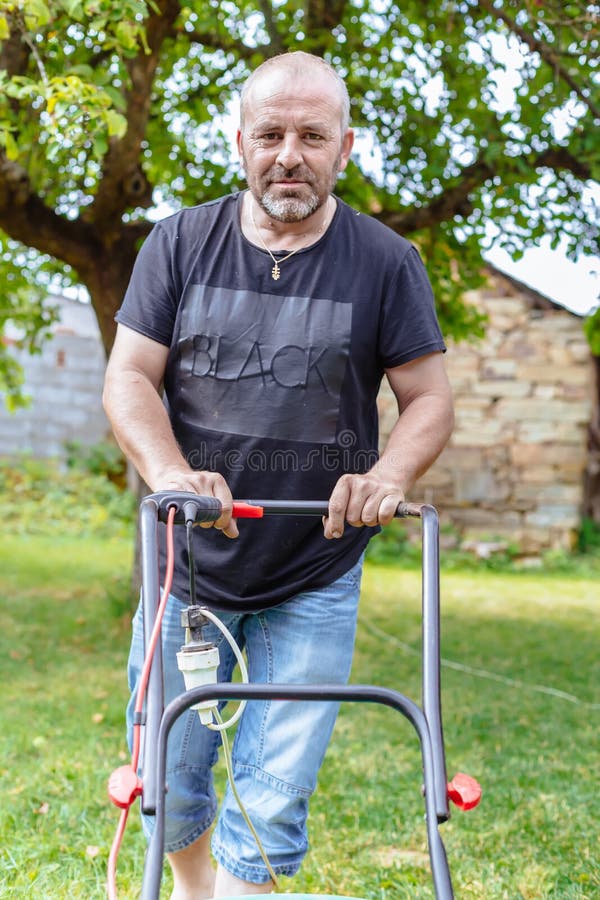 Portrait of Man Mowing Lawn Stock Image - Image of gardener, grass ...