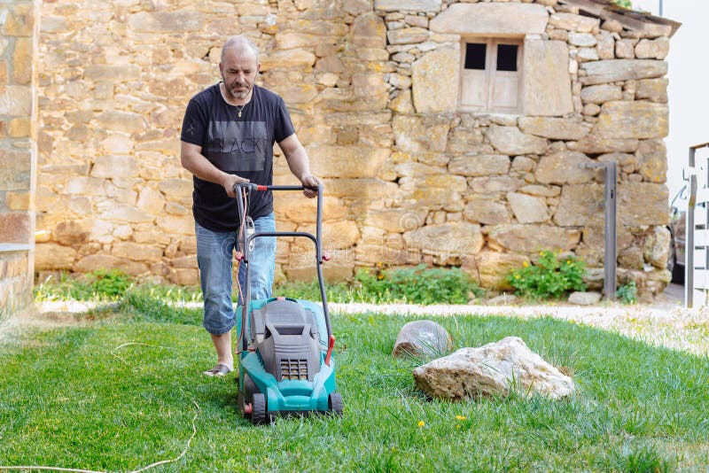 Portrait of Man Mowing Lawn Stock Photo - Image of male, gardening ...