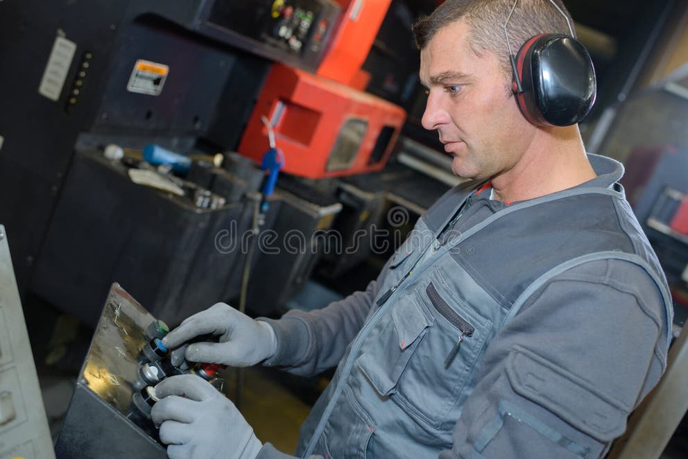 Portrait Man Operating Machine Stock Image - Image of fixing, hearing ...