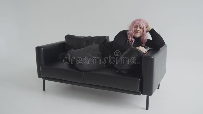 Portrait of a Man in a Pink Wig, Lying on the Sofa, Grimacing, Posing ...