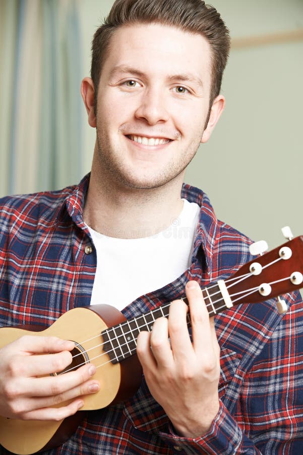 Portrait of Man Playing Ukulele Stock Photo - Image of looking, male ...