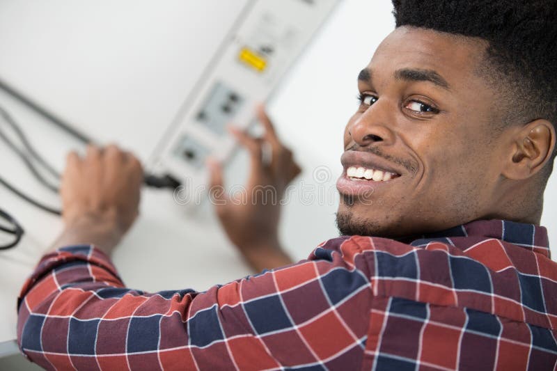 Portrait Man Plugging Power Cable into Electrical Device Stock Image ...
