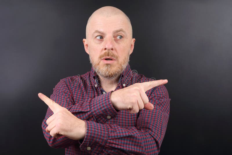 Portrait of a Man Pointing His Index Fingers in Different Directions ...