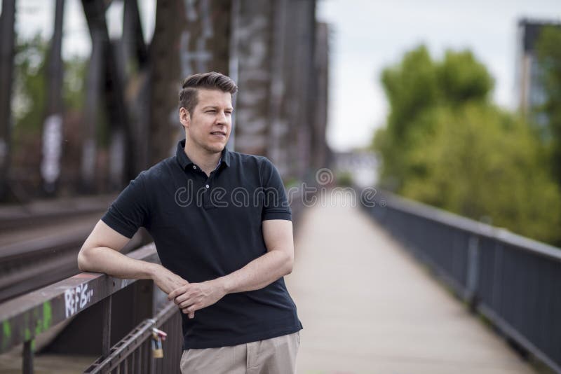 Portrait of a Handsome Man Posing on a City Bridge Stock Photo - Image ...