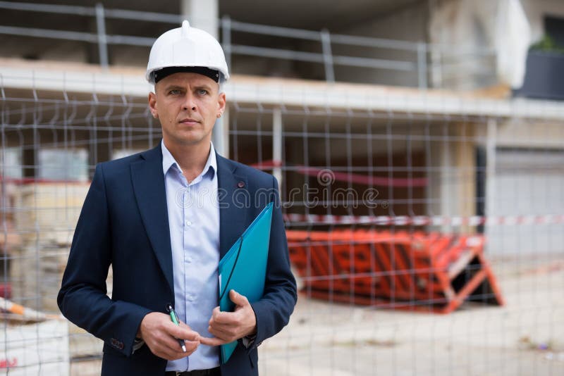 Male Engineer Checking Work Process in Construction Site Stock Photo ...