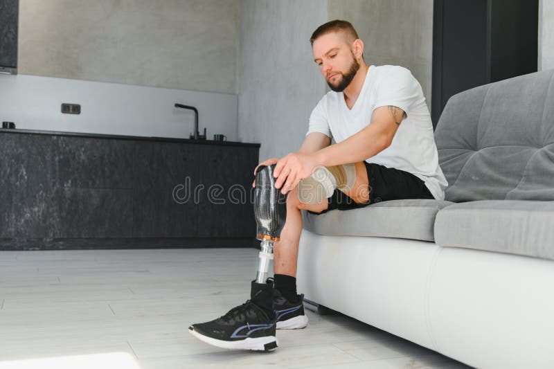 Portrait of Man with Prosthetic Leg Sitting Stock Image - Image of limb ...