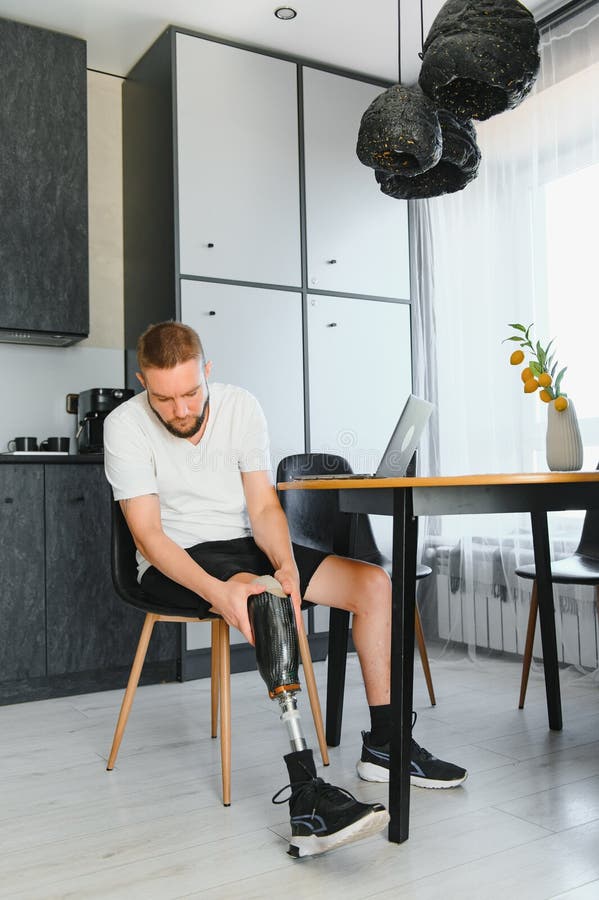 Portrait of Man with Prosthetic Leg Sitting Stock Image - Image of ...