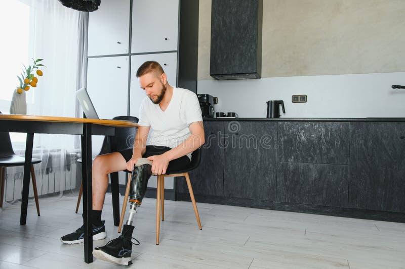 Portrait of Man with Prosthetic Leg Sitting Stock Image - Image of ...