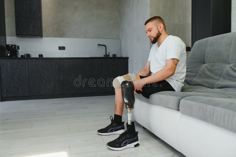 Portrait of Man with Prosthetic Leg Sitting Stock Photo - Image of ...