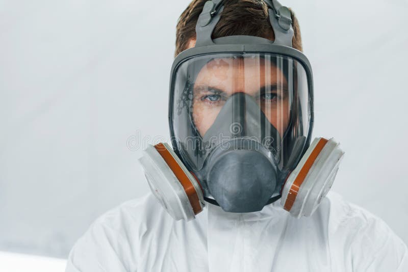Portrait of Man in the Protective Mask. Worker in Uniform is in the ...
