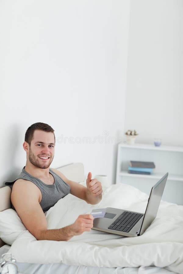 Portrait Of A Man Purchasing Online With Thumb Up Stock Image - Image ...