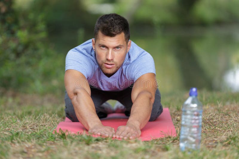 Portrait Man Reaching Forward on Exercise Mat Stock Photo - Image of ...