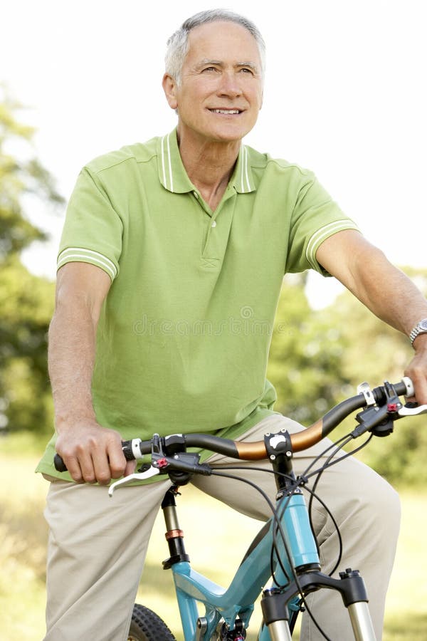 Portrait of Man Riding Cycle in Countryside Stock Photo - Image of ...