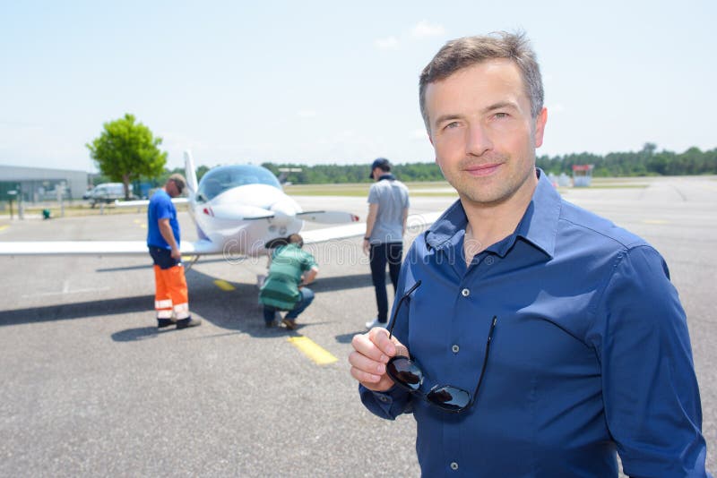 Portrait Man on Runway with Light Aircraft Stock Photo - Image of ...
