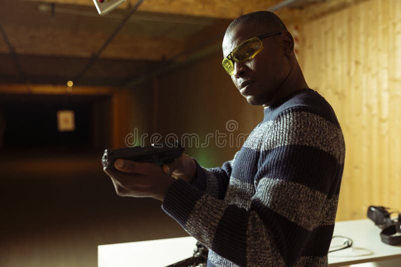 Portrait of Man in Shooting Range Doing Training, Learning Firearm ...