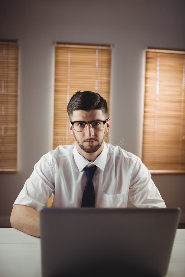 Portrait of Man Sitting in Office Stock Photo - Image of caucasian ...