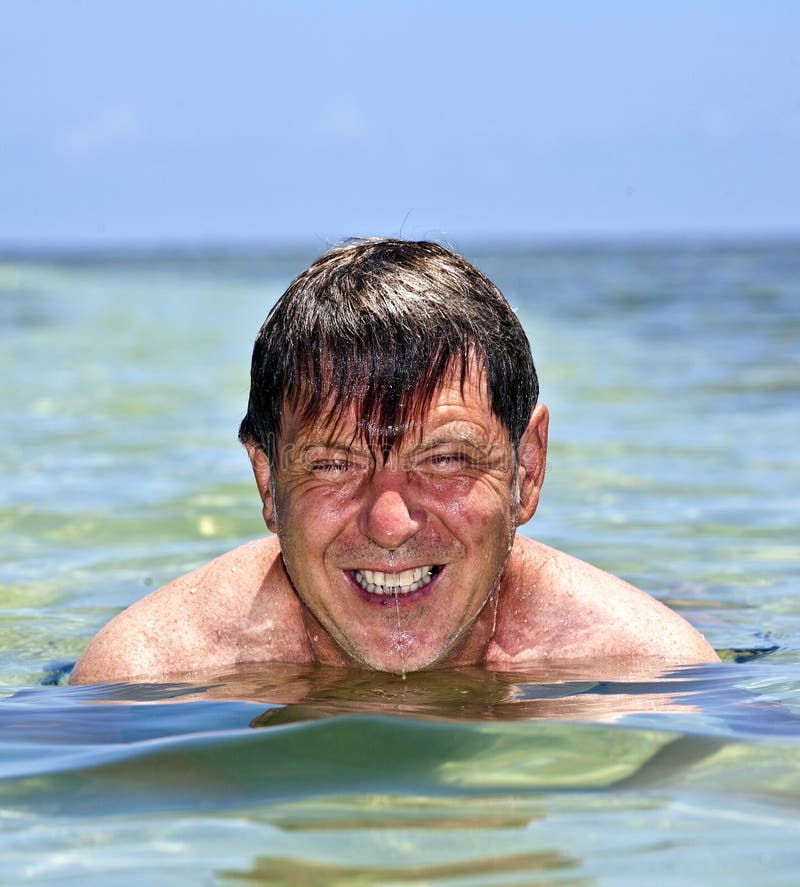 Portrait of a Man Swimming in the Ocean Stock Image - Image of clear ...