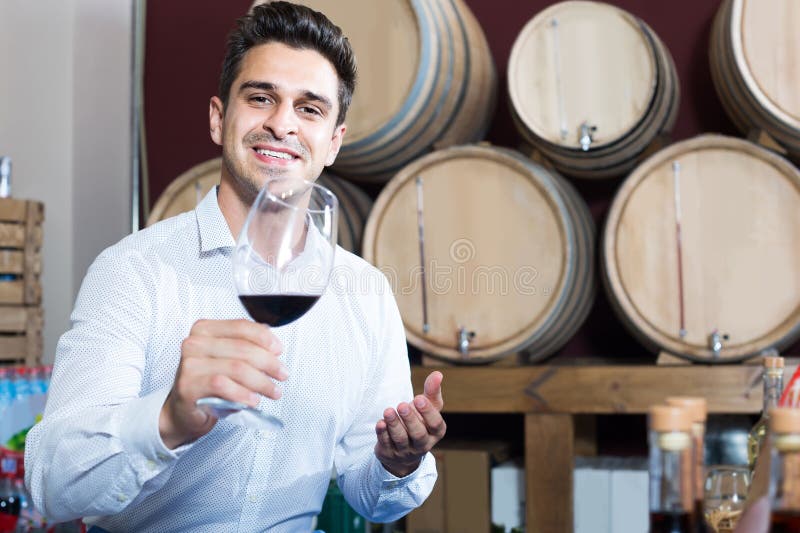 Portrait of Man Tasting Wine Sample in Glass in Alcohol Section Stock ...